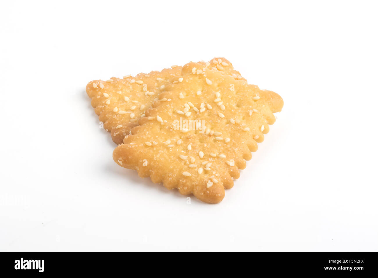 Biscuits pile on white background Stock Photo - Alamy