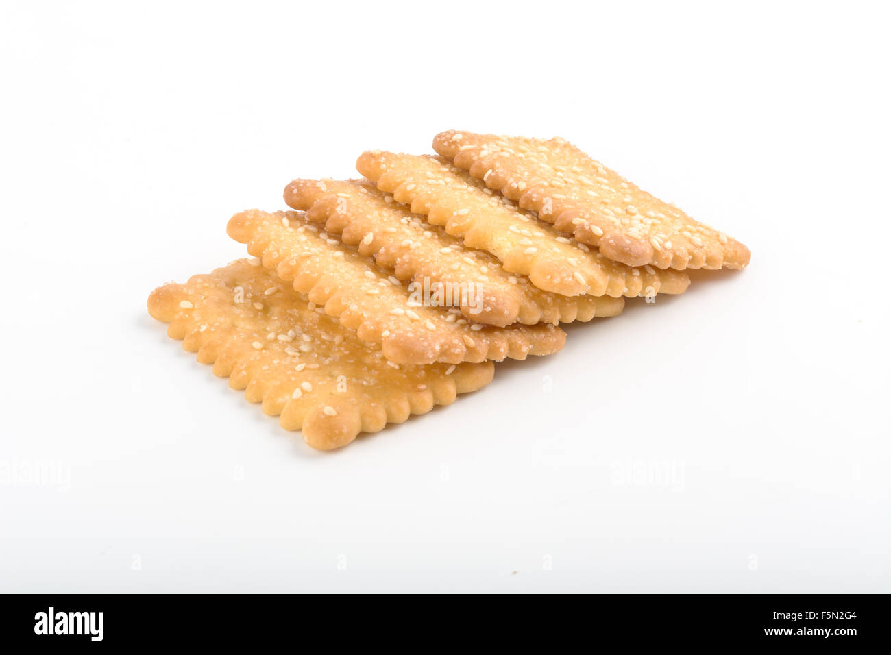 Biscuits pile on white background Stock Photo - Alamy