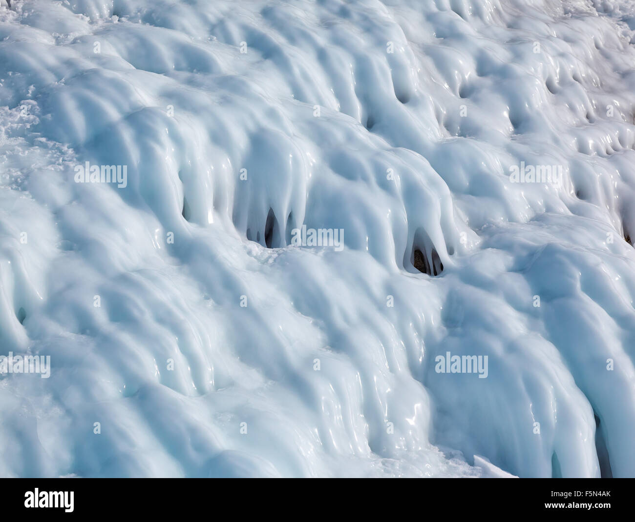Icicles background on the ice wall on Baikal lake at winter Stock Photo ...