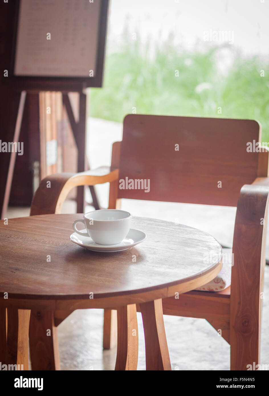 Coffee cup on table in coffee shop, stock photo Stock Photo - Alamy