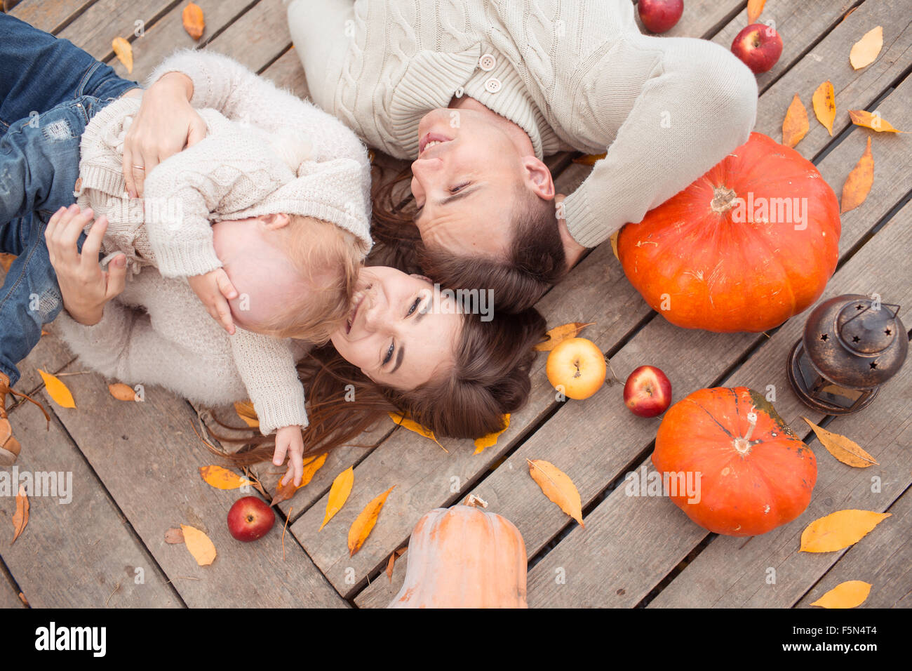 Family resting on the lake Stock Photo - Alamy