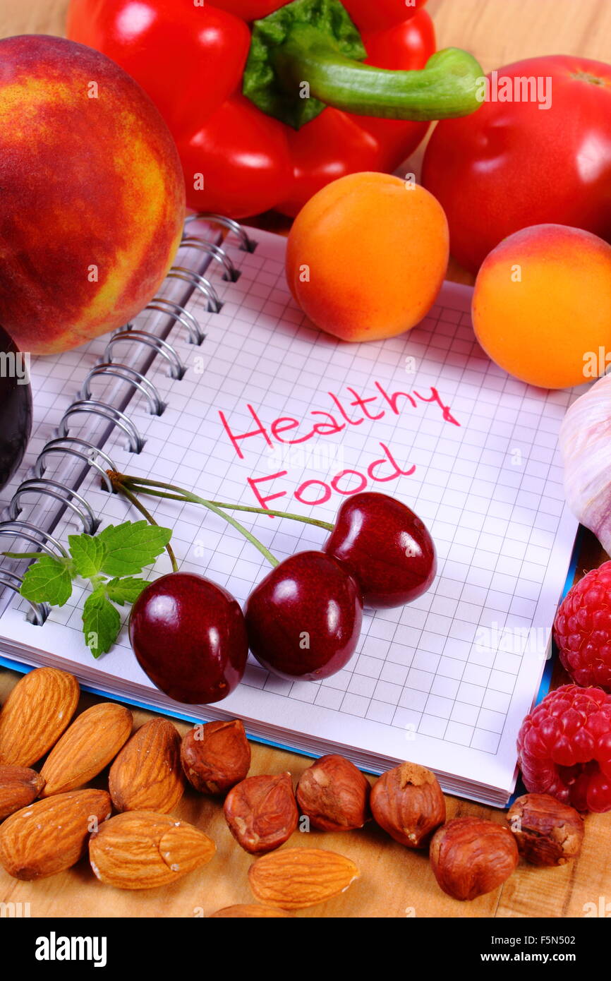 Fresh fruits and vegetables with notebook for writing notes, concept of ...