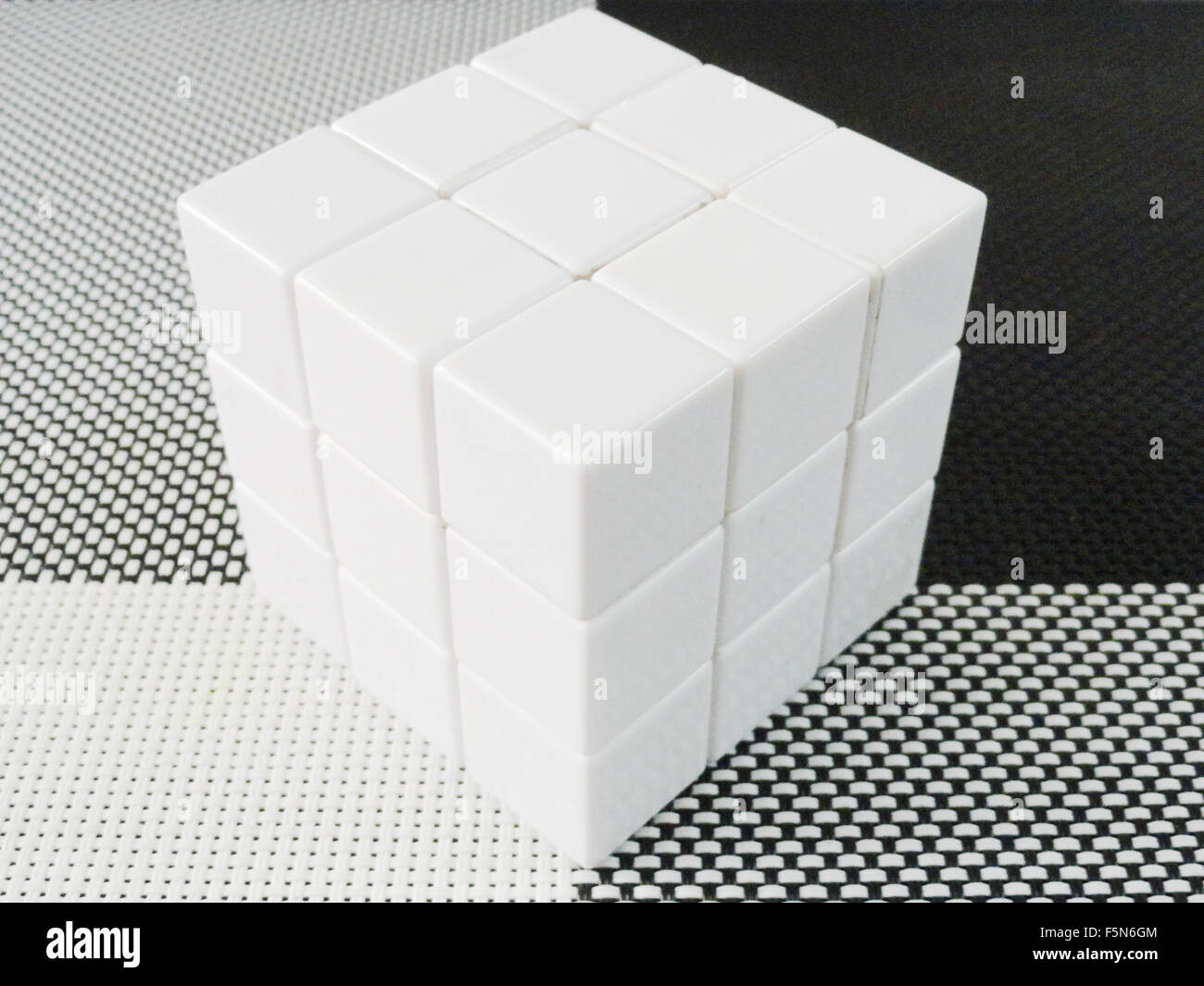 Rubik's white cube on a black and white background Stock Photo - Alamy