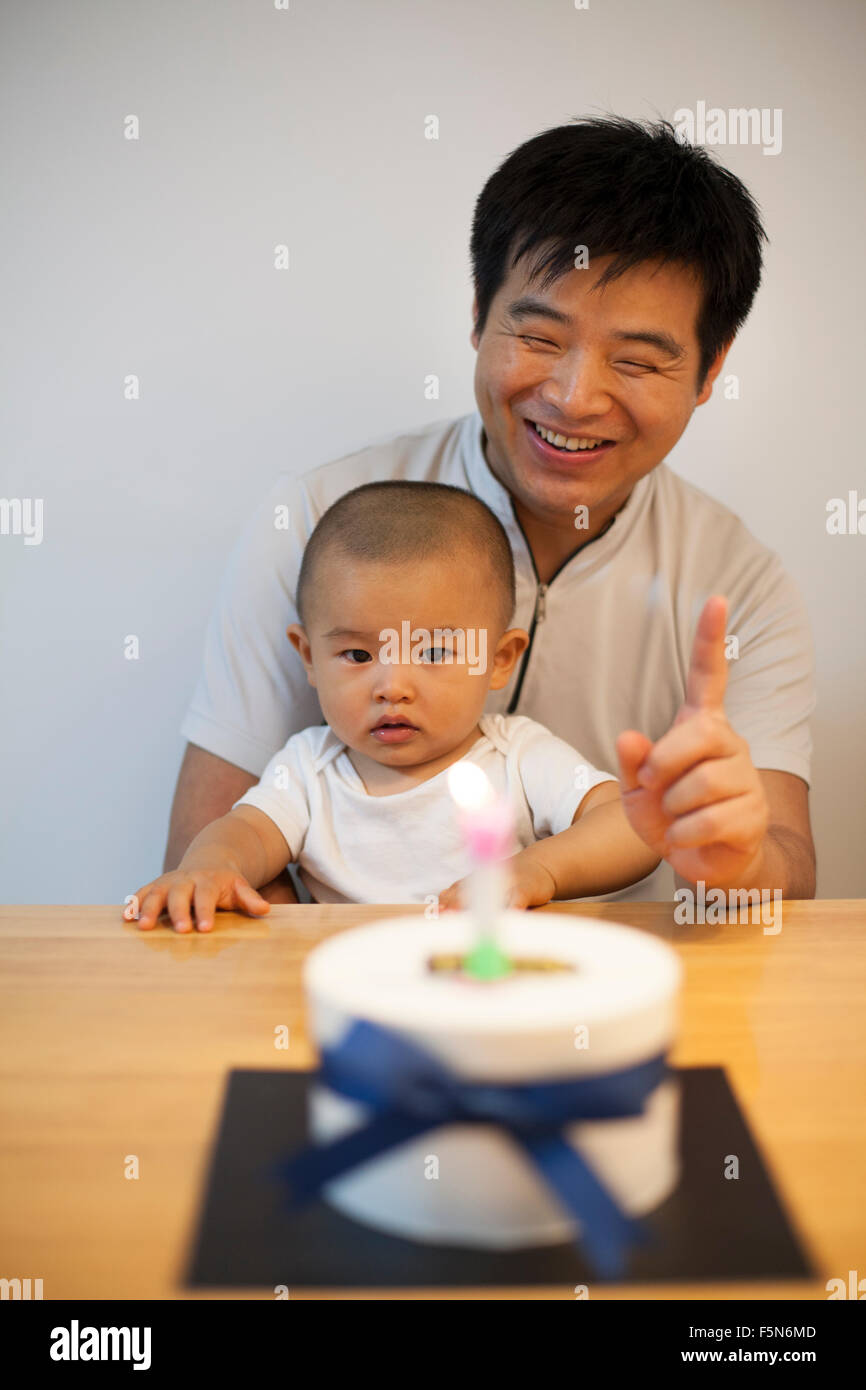 Chinese father and son celebrating son's one year old birthday, shot in ...