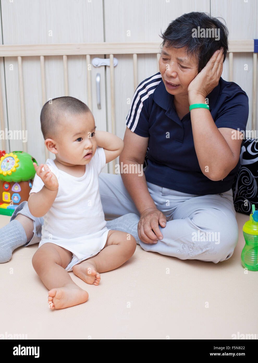 Chinese baby boy playing with grandma, shot in Beijing, China Stock ...