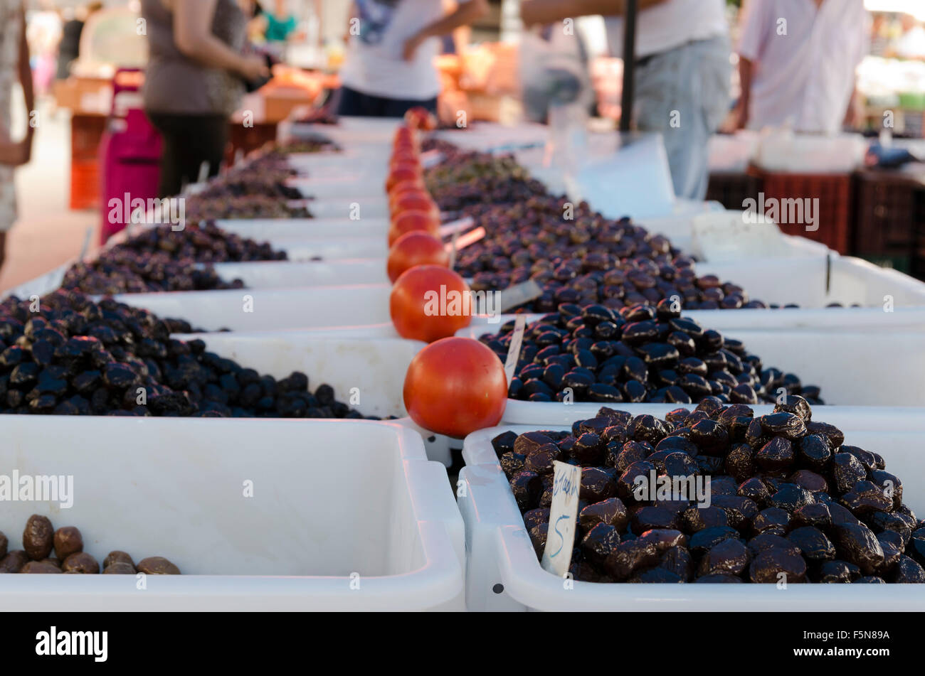 Olives of different taste and size in boxes in a market in the North of ...
