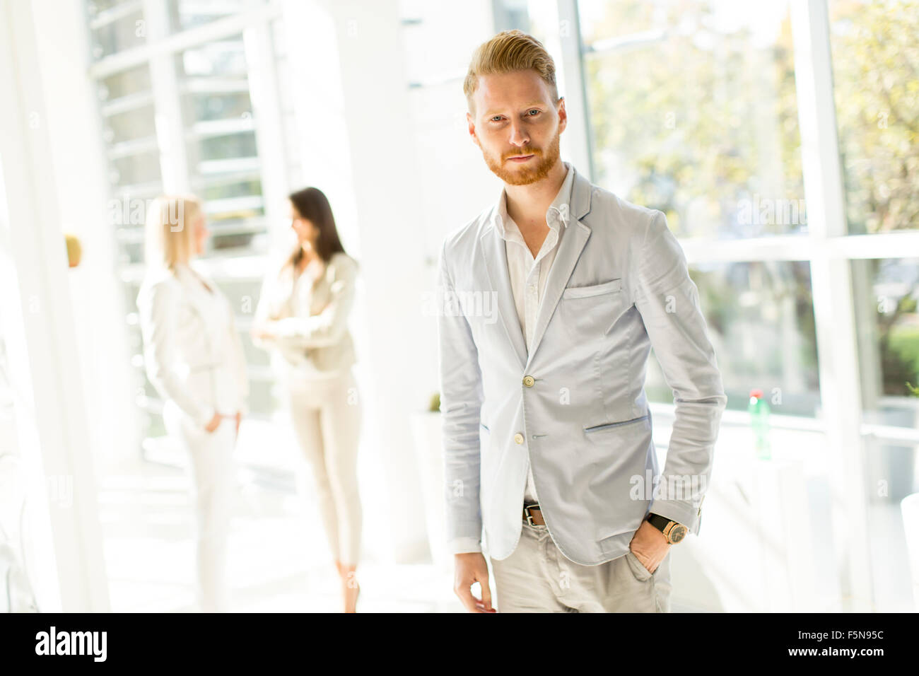 Young man in the office Stock Photo - Alamy