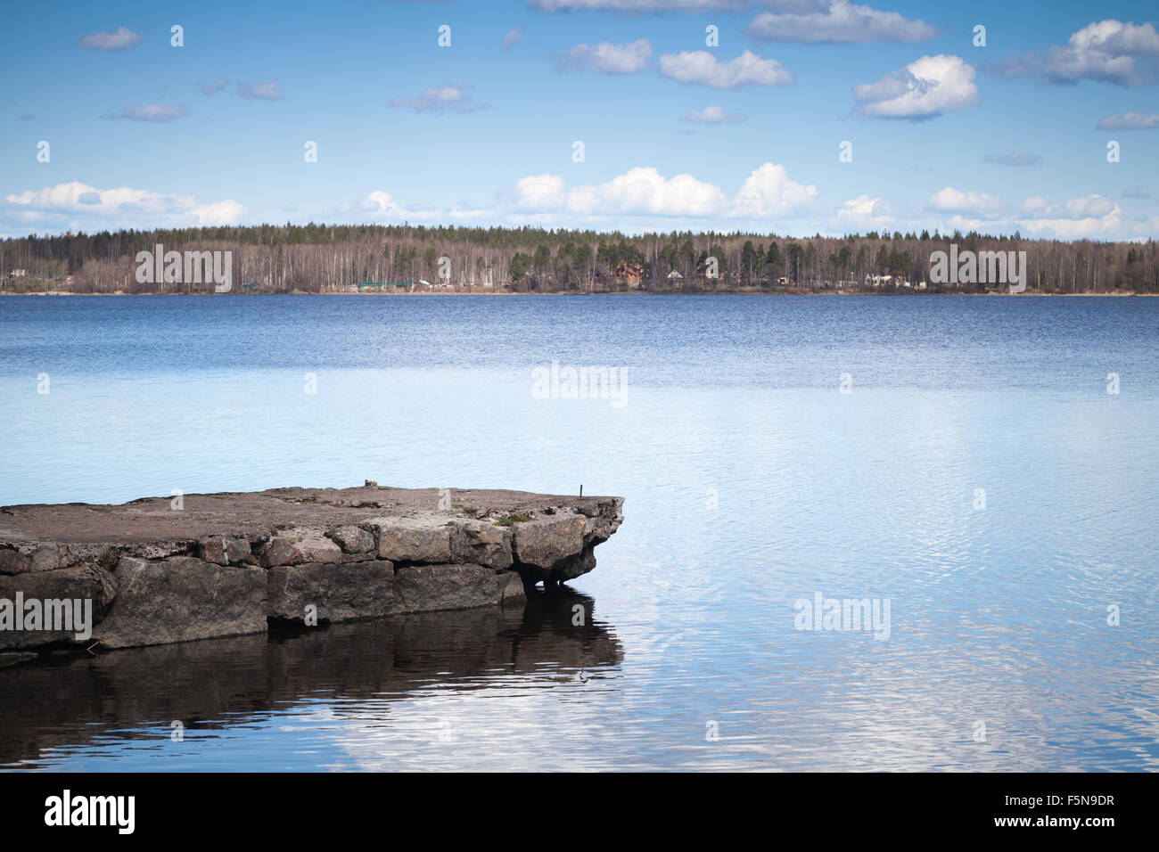 Still lake coastal landscape with old stone pier, Monrepo park, Vyborg ...