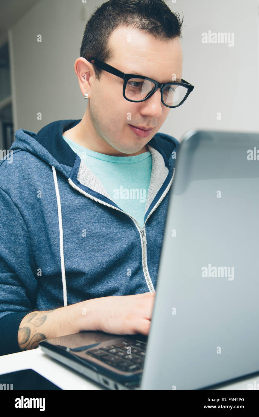 Young man on the computer hi-res stock photography and images - Alamy