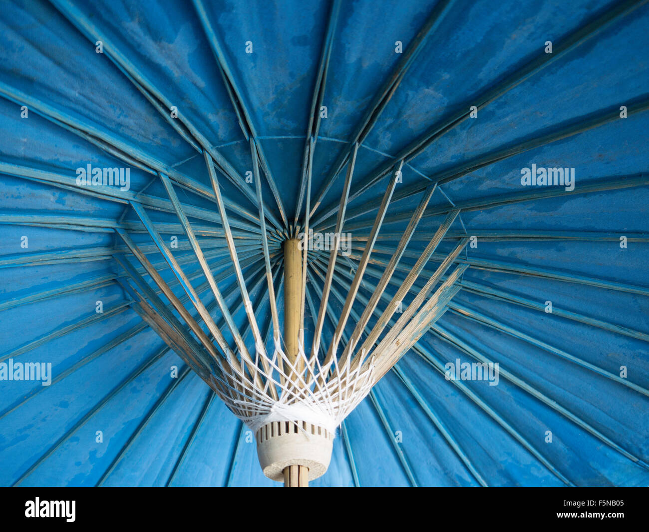 Blue parasol opened paper umbrella Stock Photo - Alamy