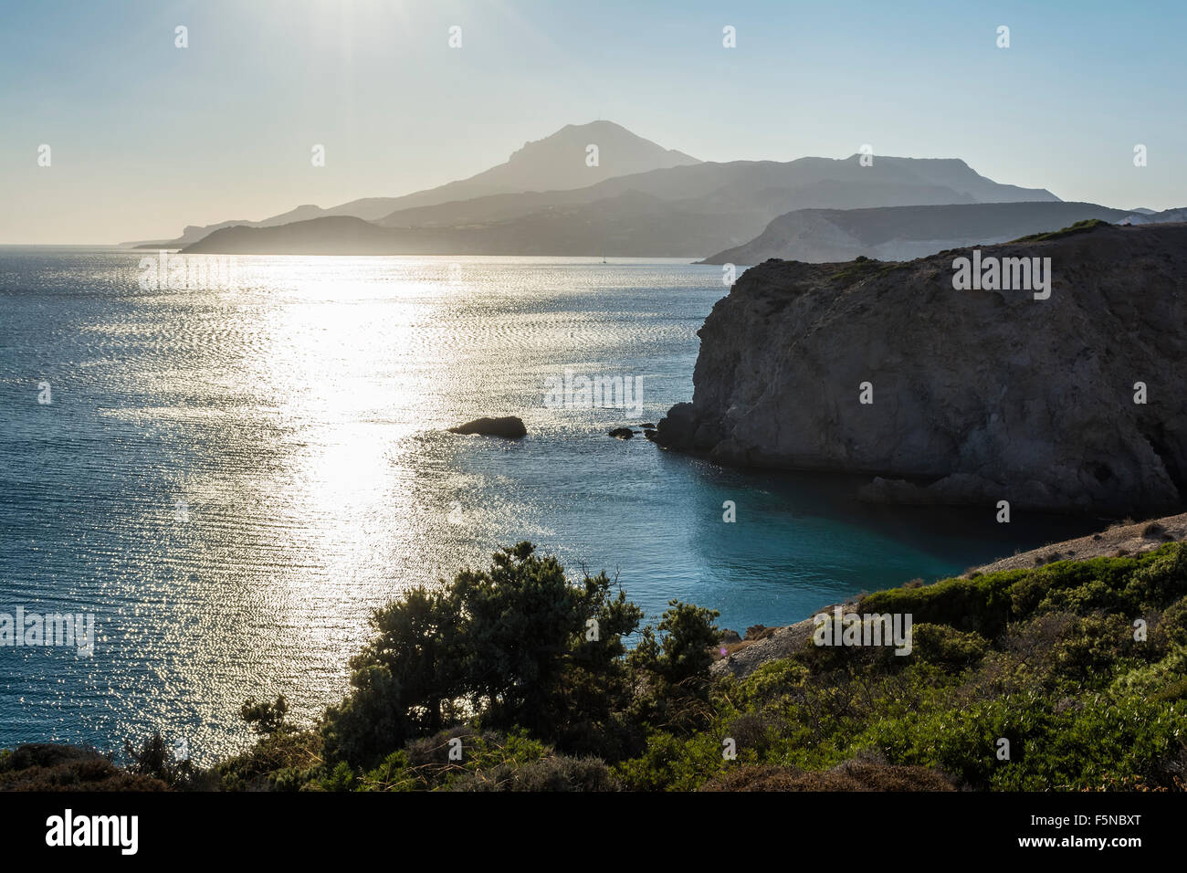 Sunset at a beach of Greek island of Milos Stock Photo - Alamy