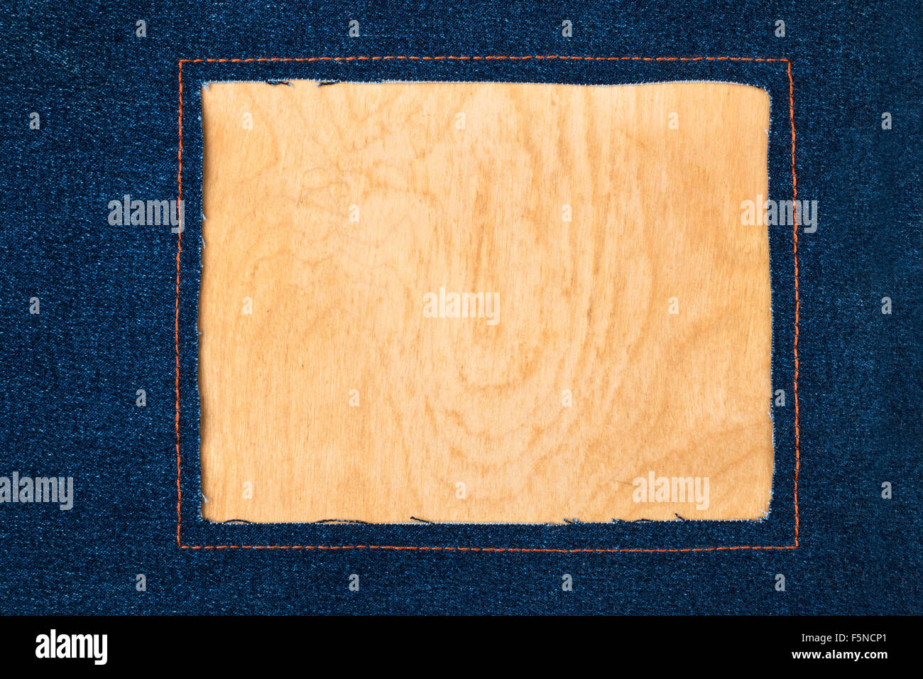 Frame for the text from a dark jeans fabric with the stitched lines of ...