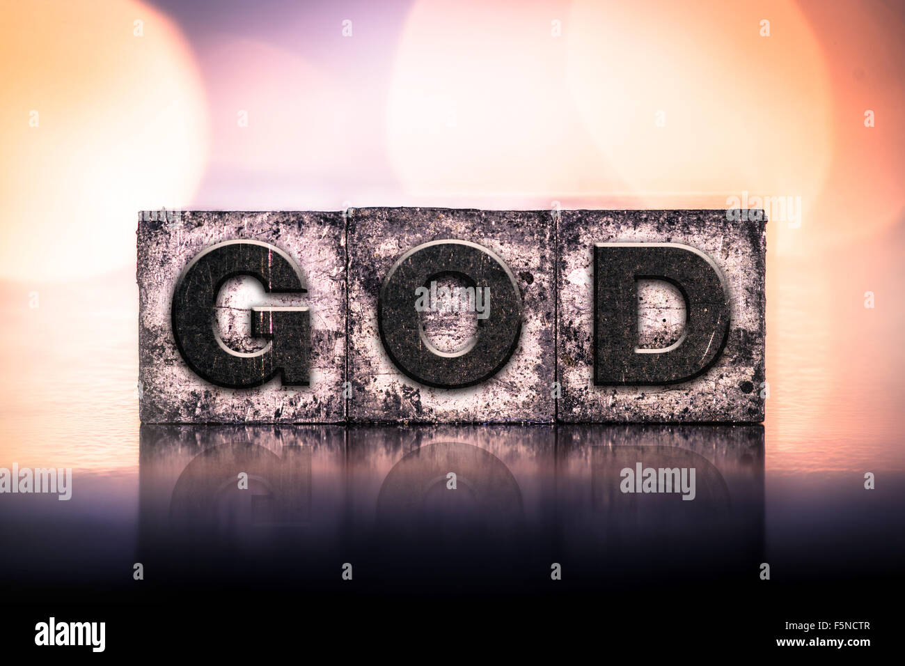 The word "GOD" written in vintage ink stained letterpress type Stock ...