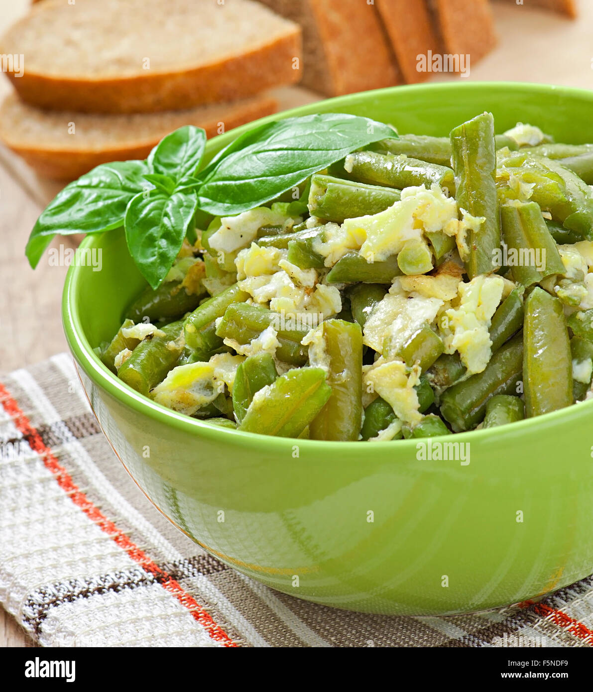 String beans with eggs in bowl Stock Photo - Alamy