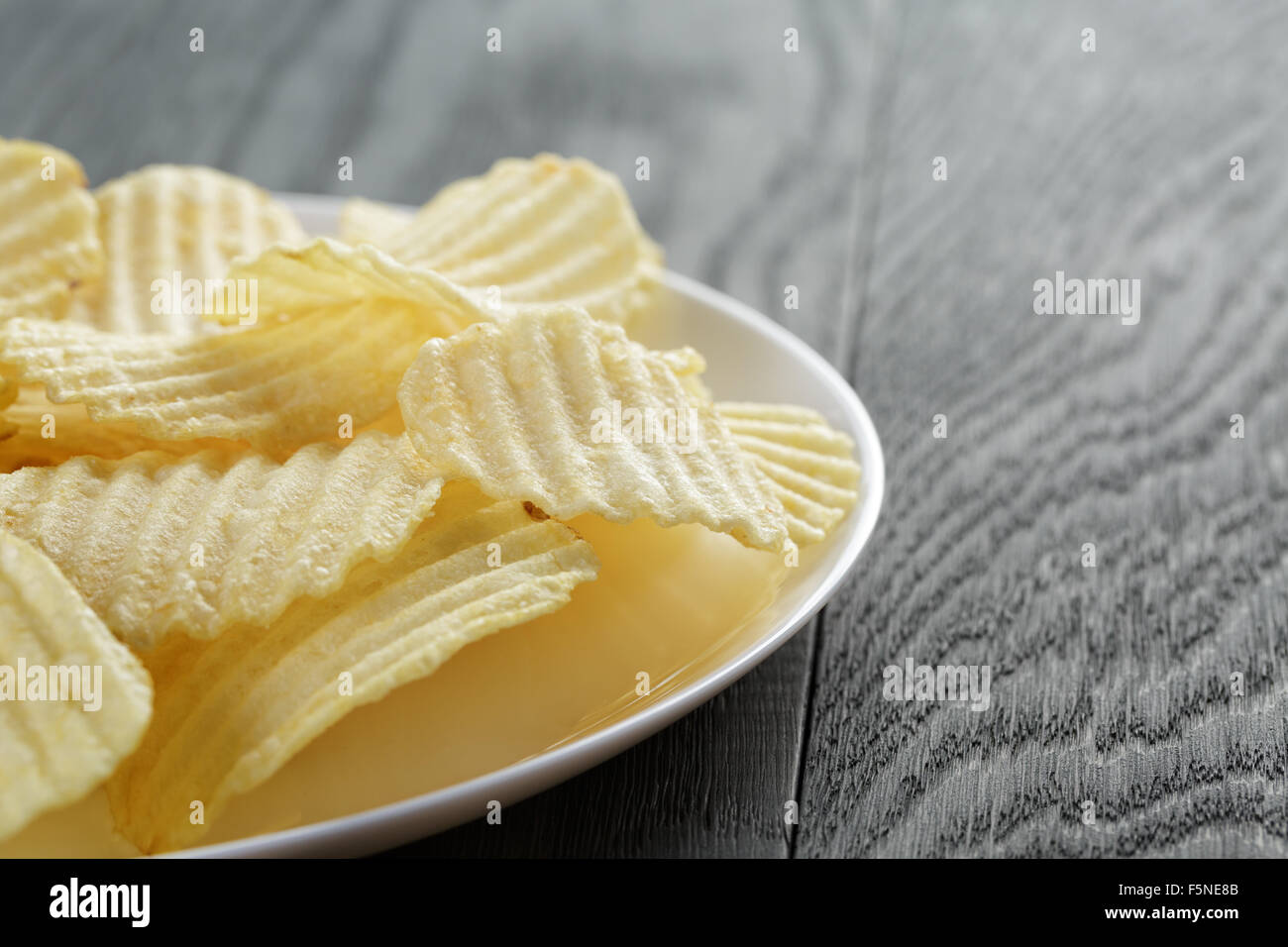 potato chips in white plate Stock Photo - Alamy