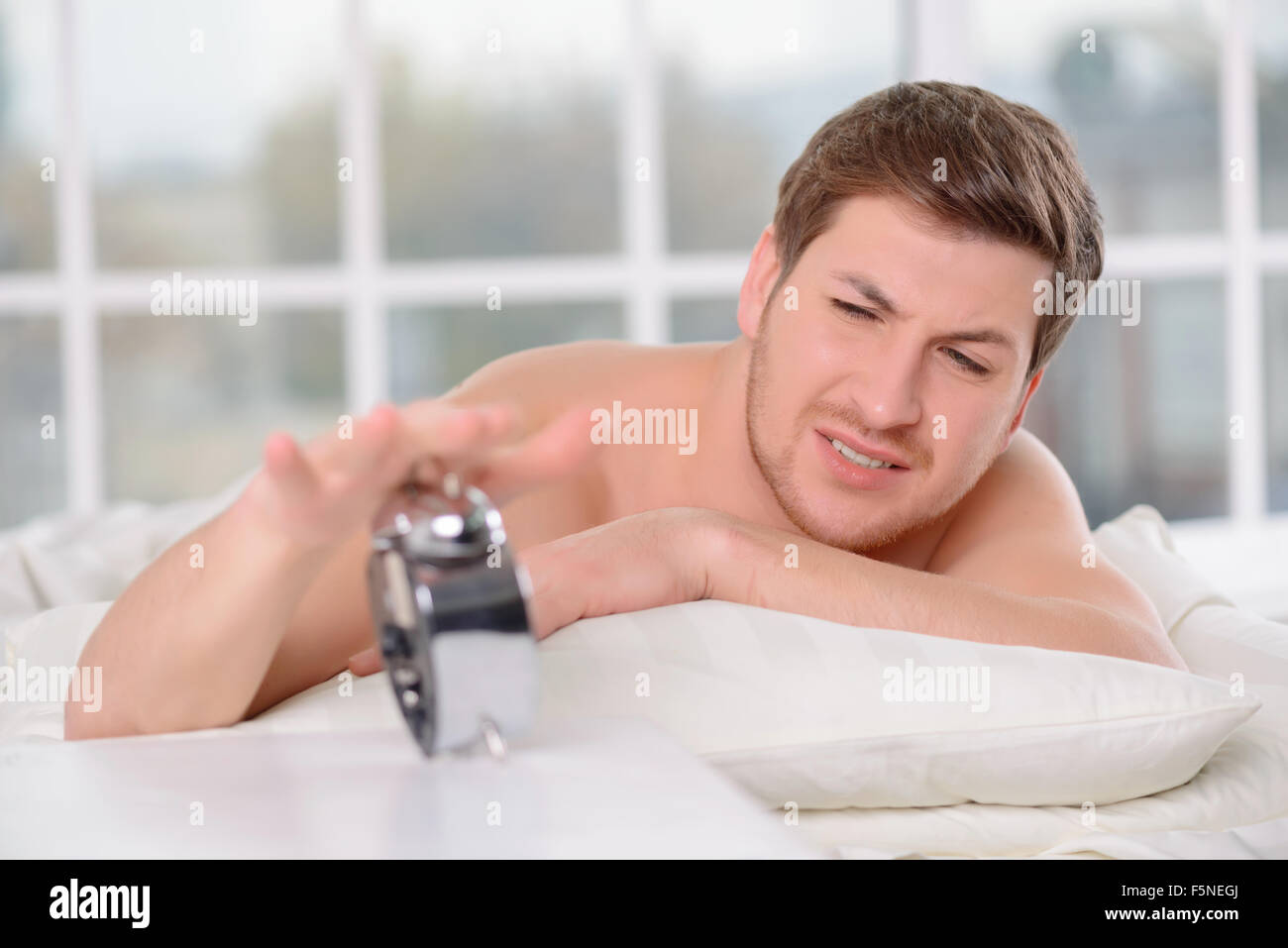 Morning alarm early awakening annoyed hi-res stock photography and ...