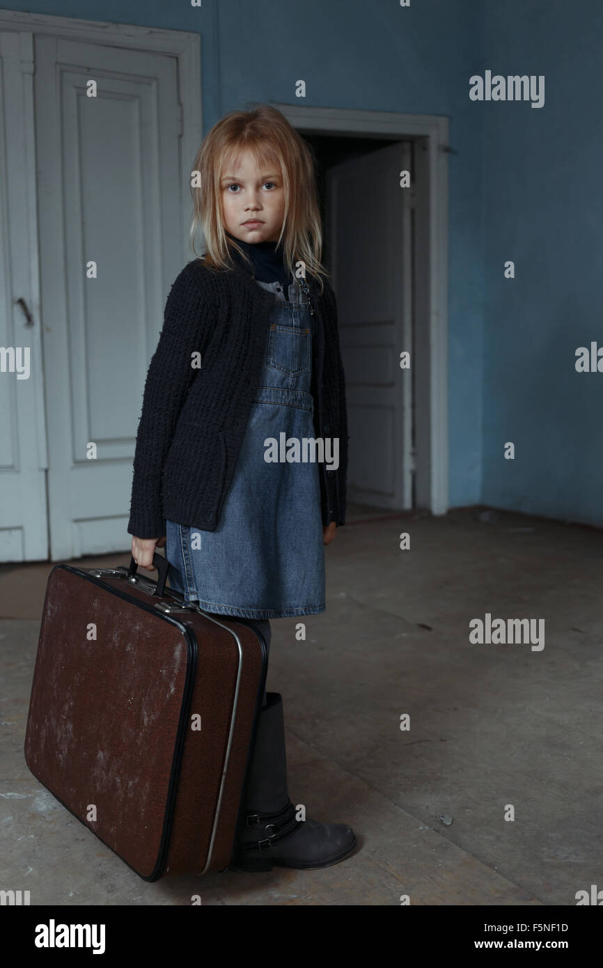 Miserable girl leaving the room Stock Photo - Alamy