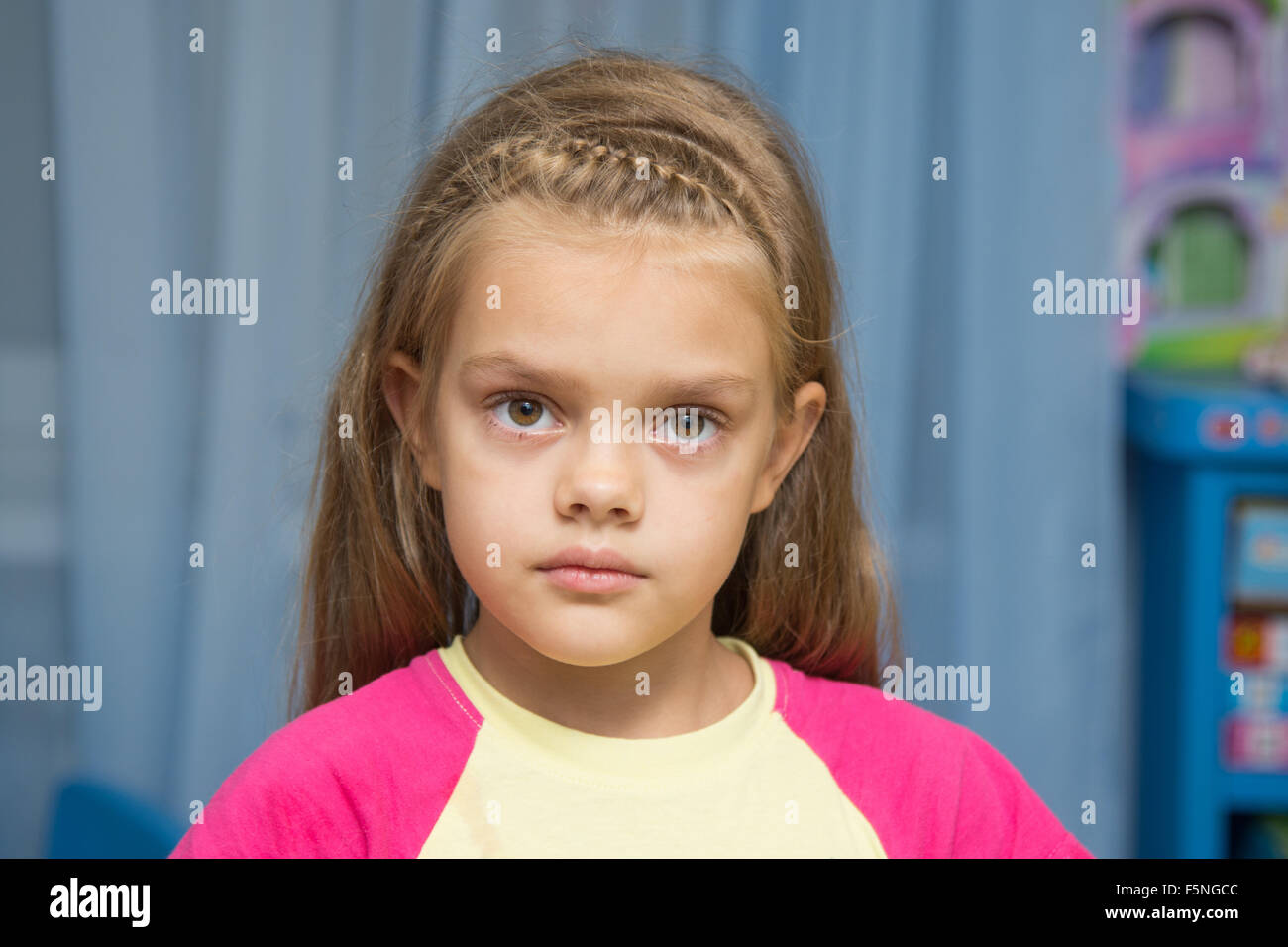 Five-year girl is upset in the nursery calmed down after crying Stock ...