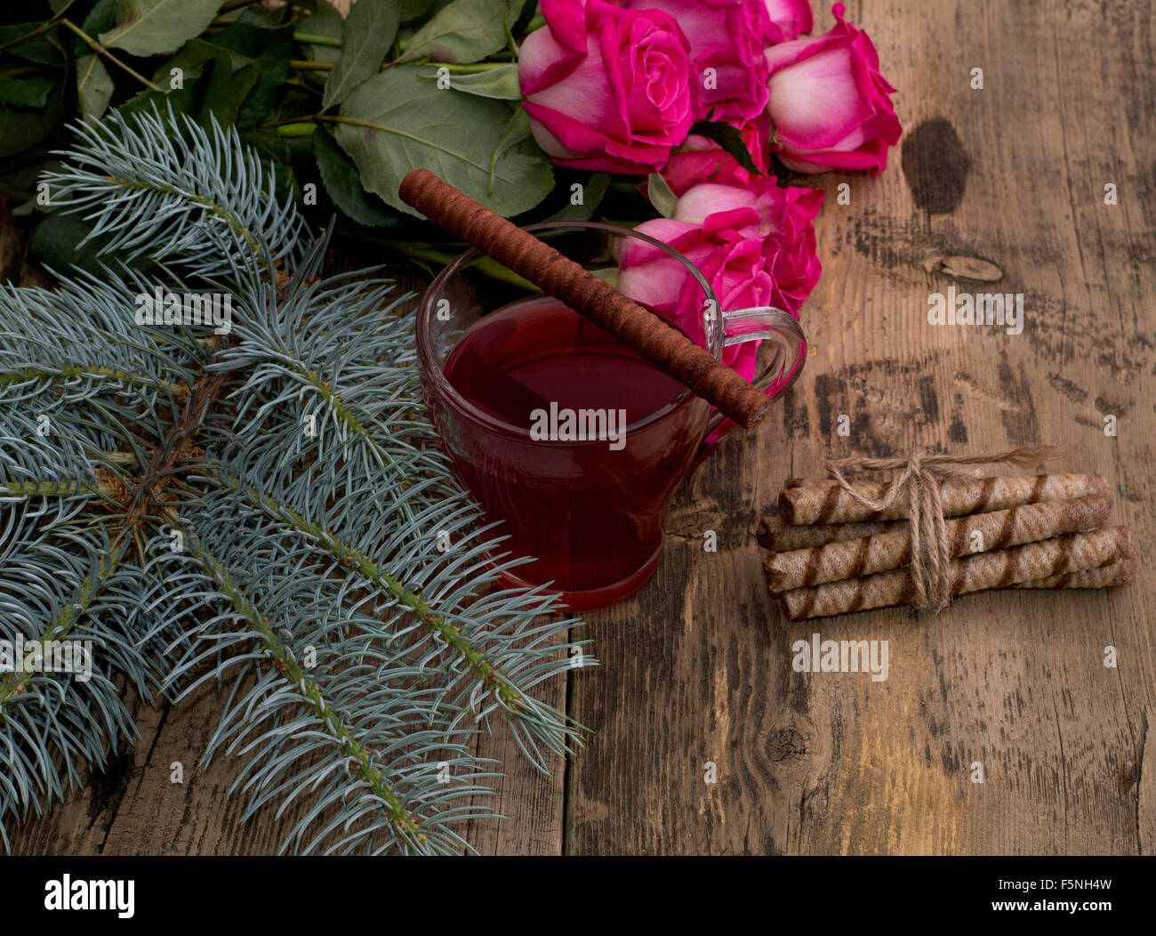 fir-tree branch, tea, linking of cookies and bouquet of roses Stock ...