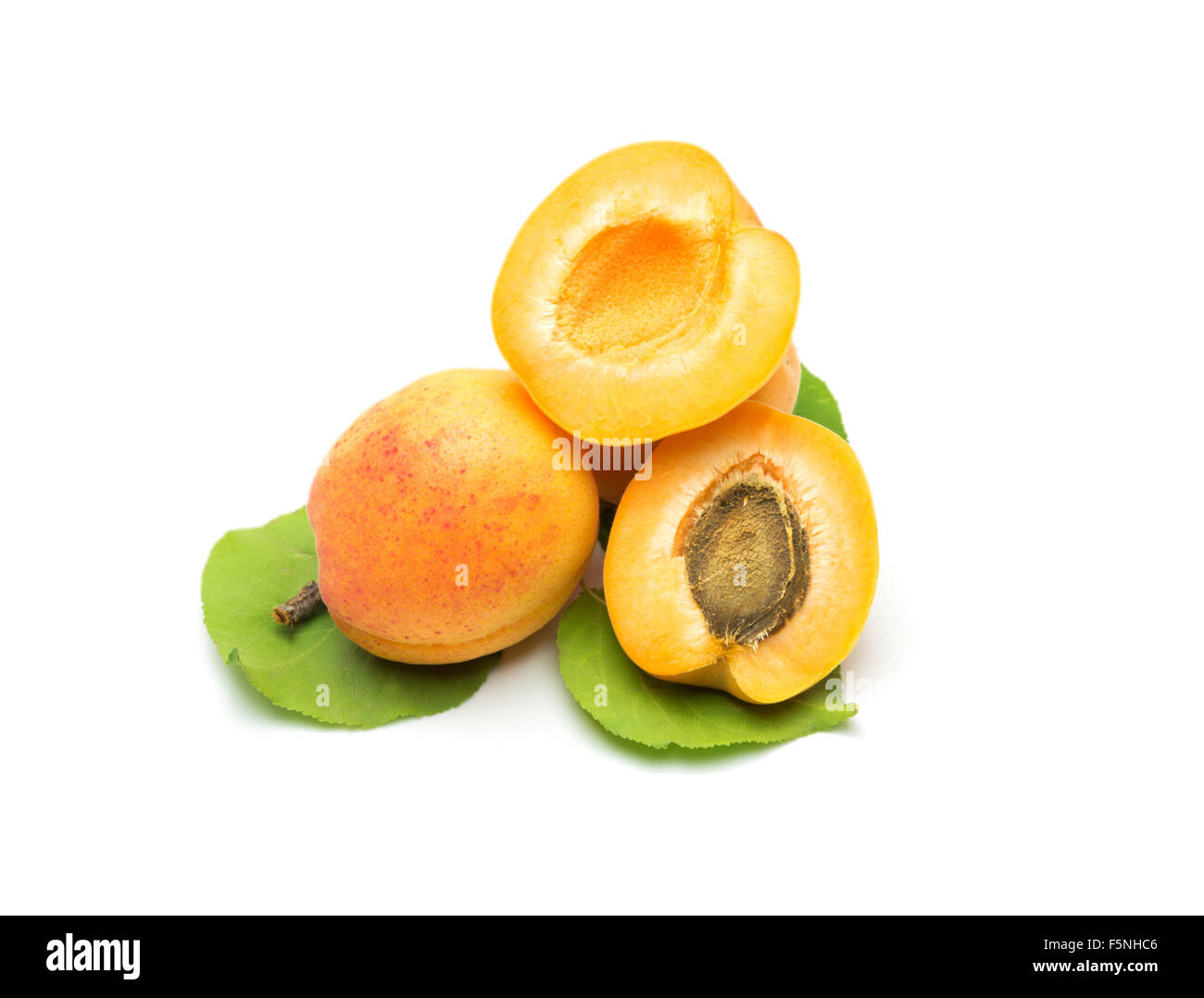 fresh bio yellow apricots on white background Stock Photo - Alamy