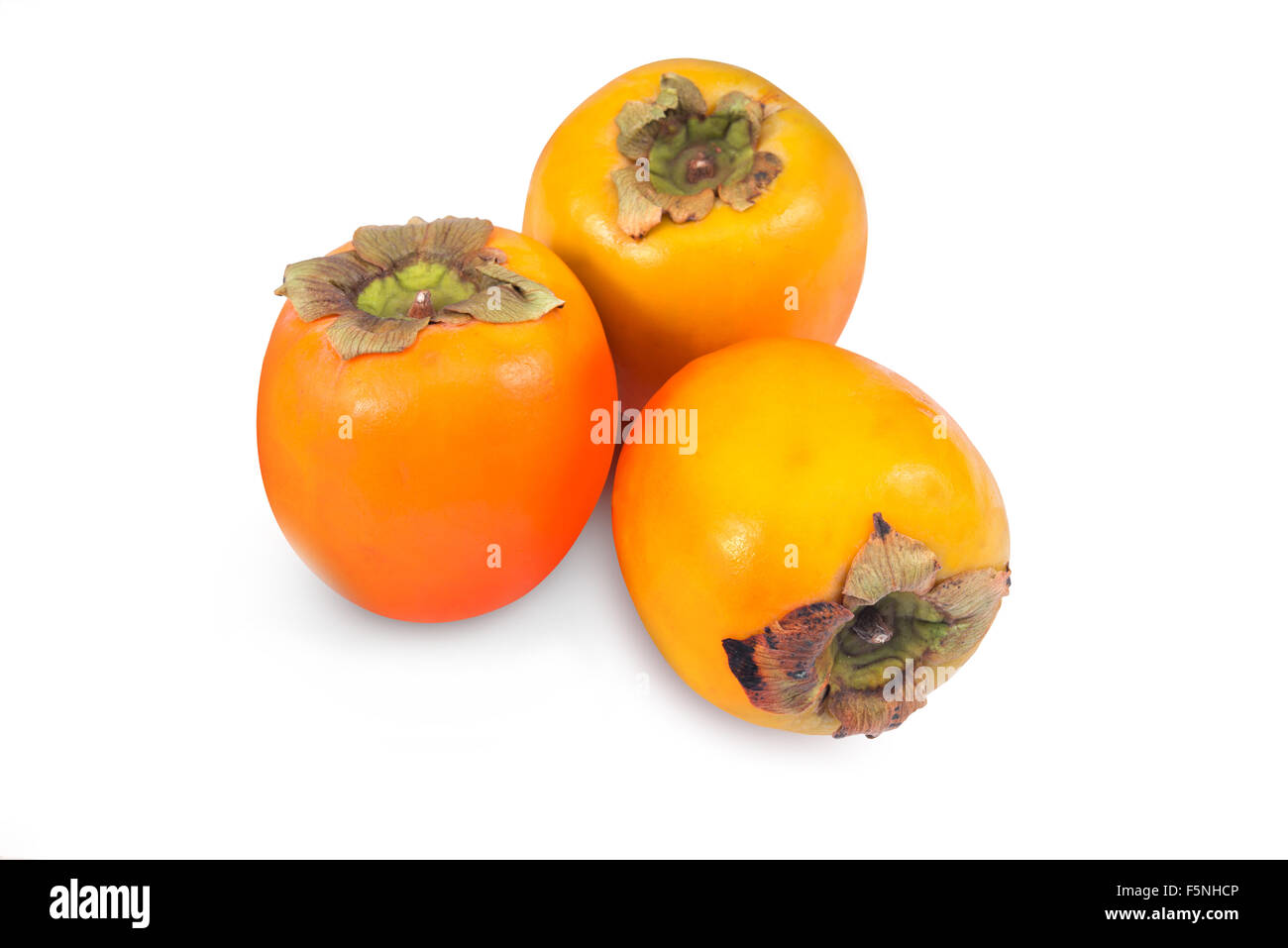fresh natural kaki fruits on white background Stock Photo - Alamy