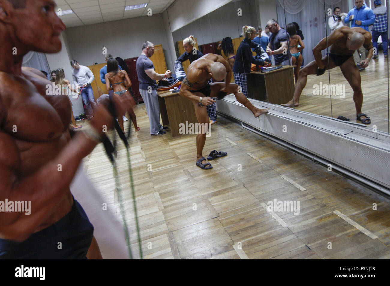 Kiev, Ukraine. 7th Nov, 2015. Body builders train backstage during the ...