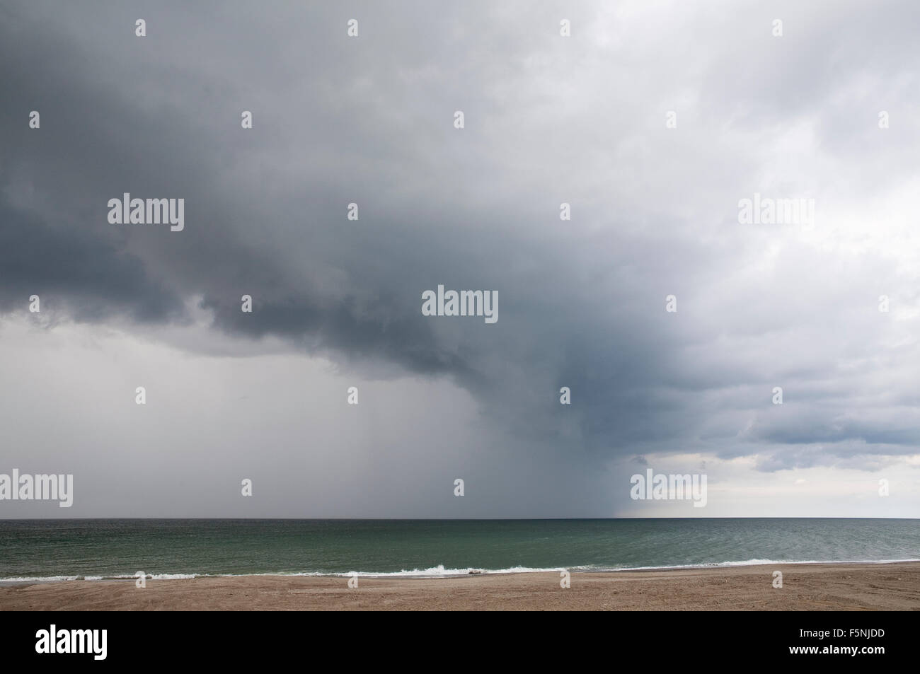 A dramatic storm out at sea is whipping up the clouds but strangely ...