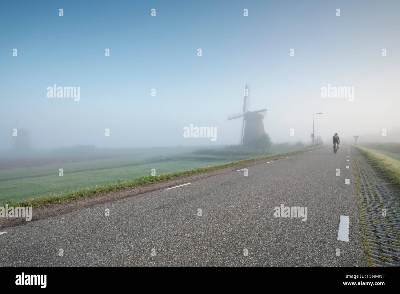 Windmill in Holland, The Netherlands in the early morning Stock Photo ...