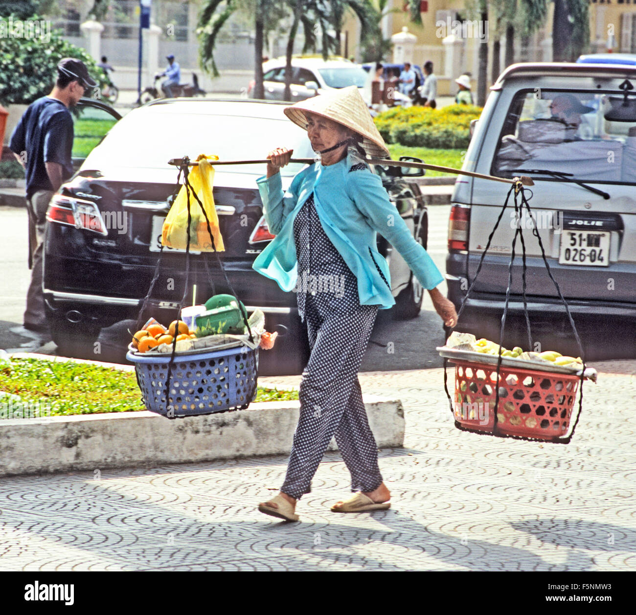 Vietnam Saigon (Ho Chi Minh) Street Hawker Carring Food on a Yoke Pole ...