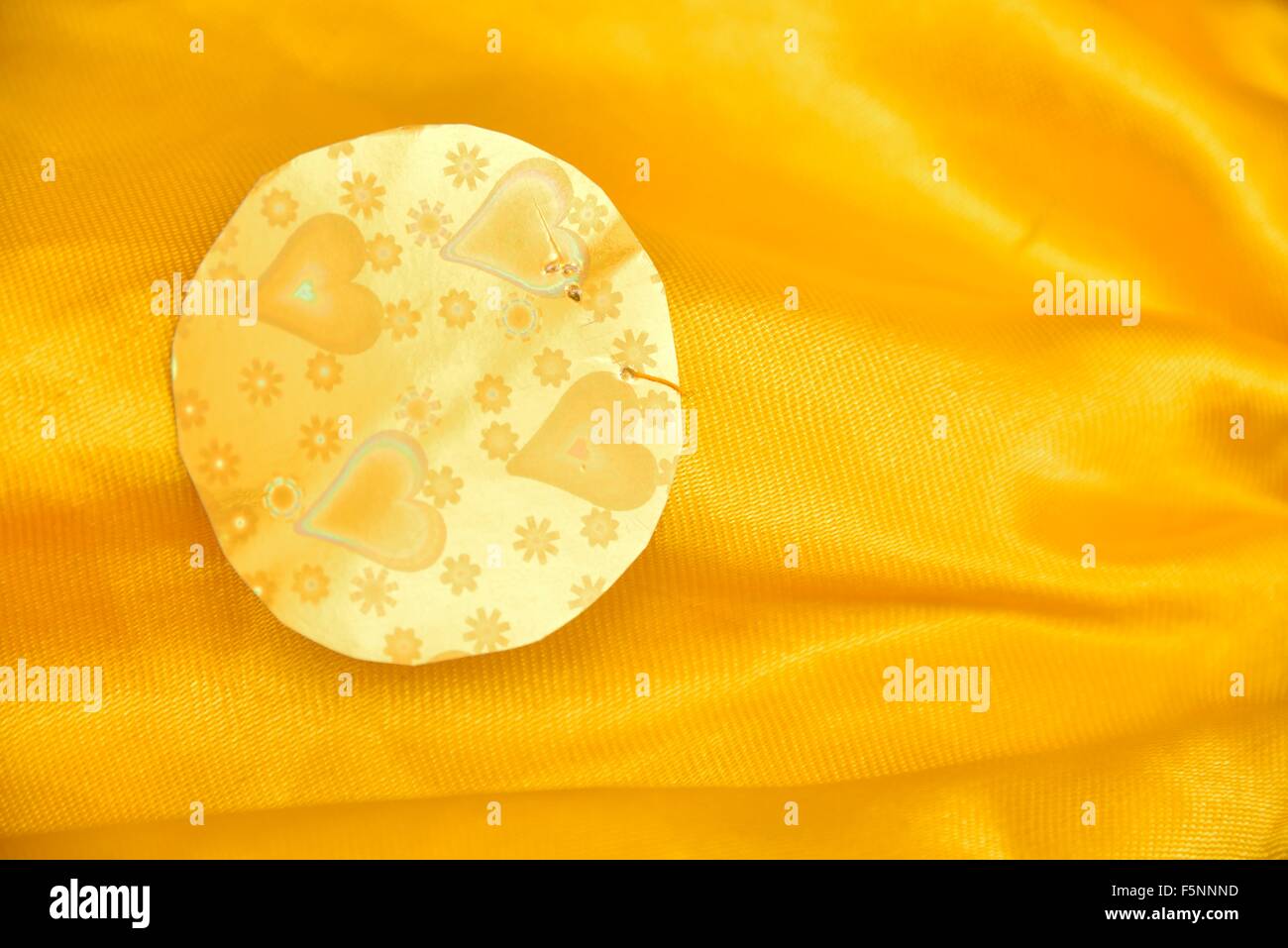 yellow satin fabric with folds (background Stock Photo - Alamy