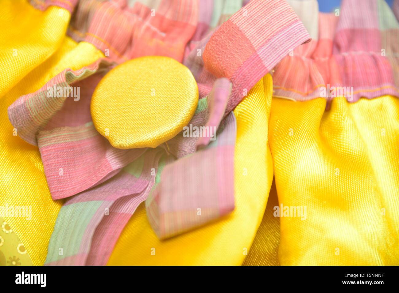 yellow satin fabric with folds (background Stock Photo - Alamy