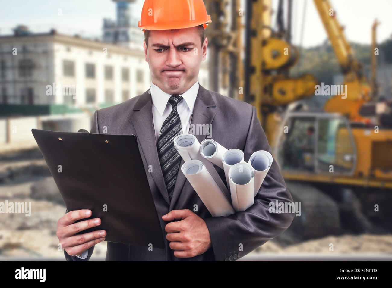Chief engineer checks the project holding some technical drawings Stock ...