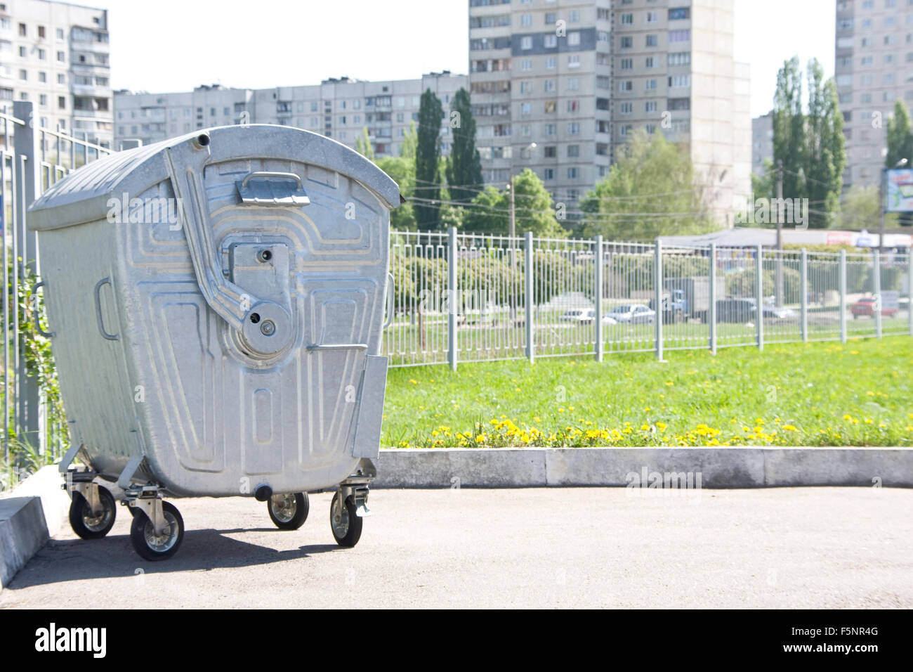 Garbage bin in city Stock Photo - Alamy