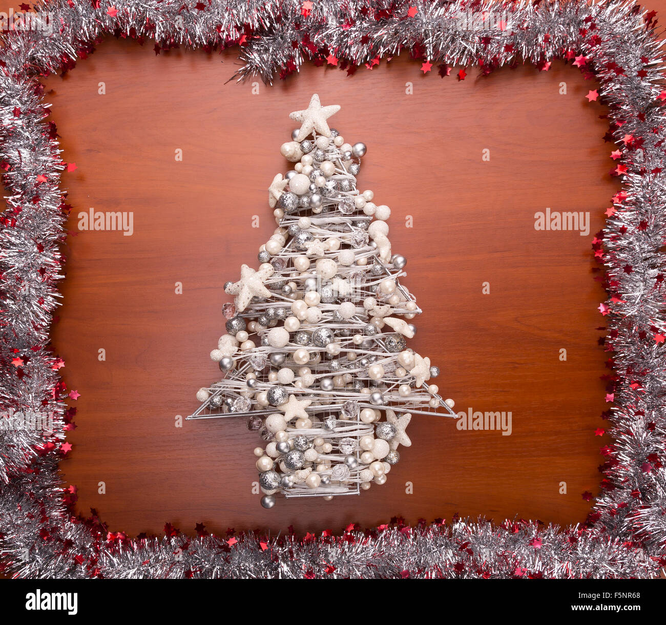 Decorated christmas tree framed with streamer Stock Photo - Alamy