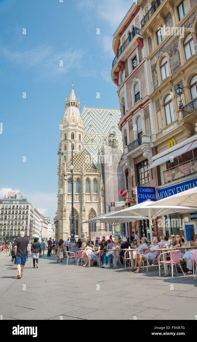 VIENNA, AUSTRIA - AUGUST 3, 2015: people sitting and walking in the ...