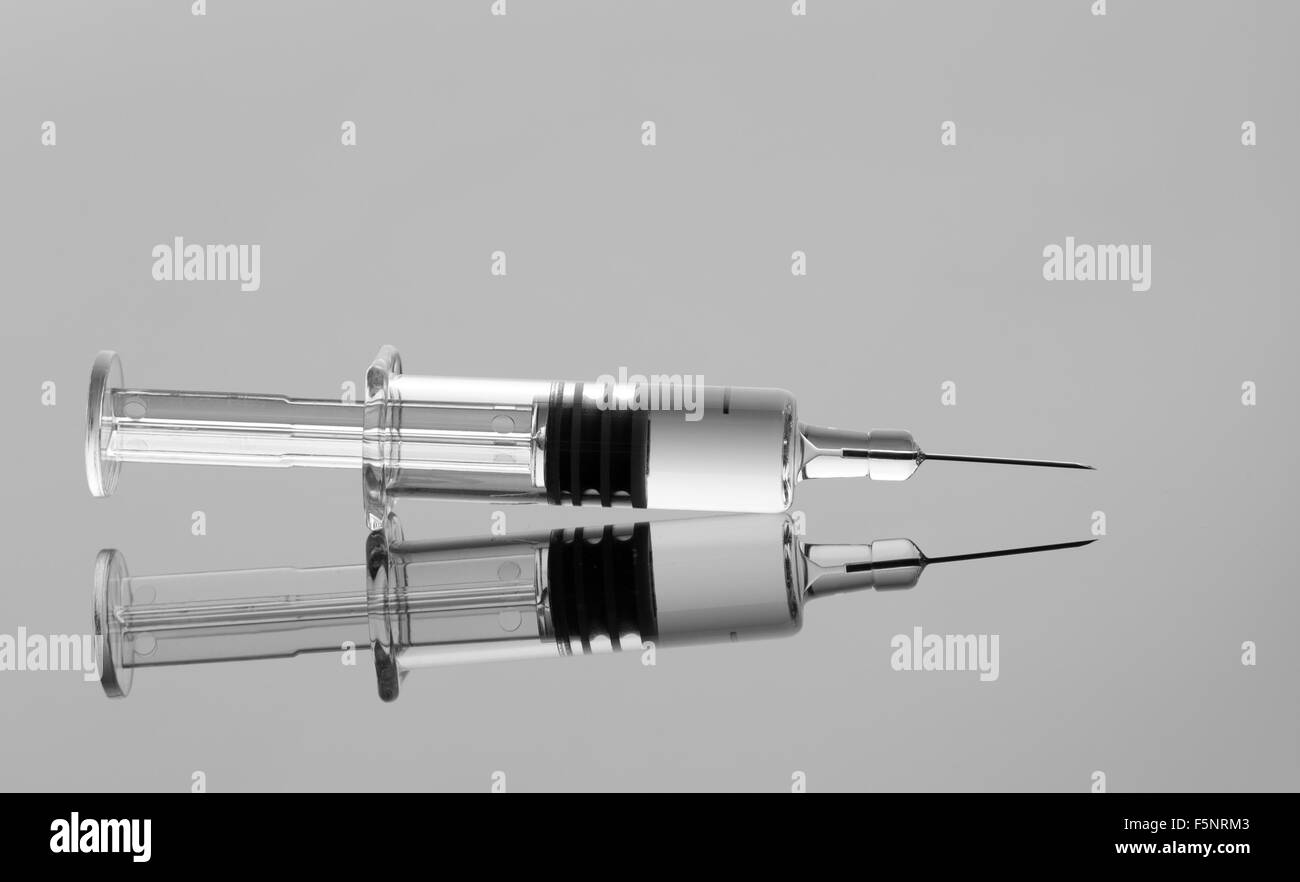Small medical syringe with vaccine Stock Photo - Alamy