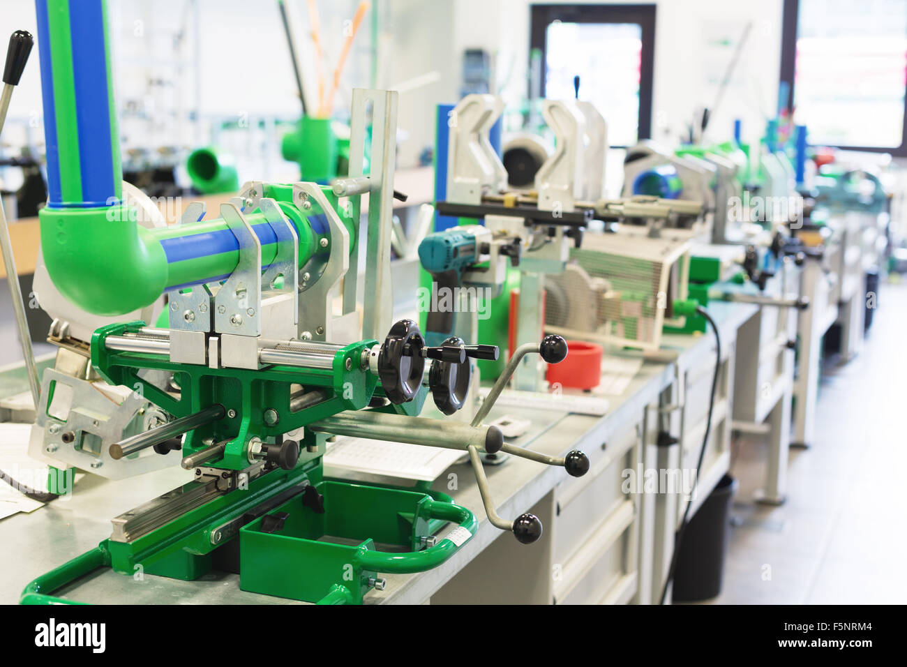 Assembly line of pipelines at workroom Stock Photo - Alamy