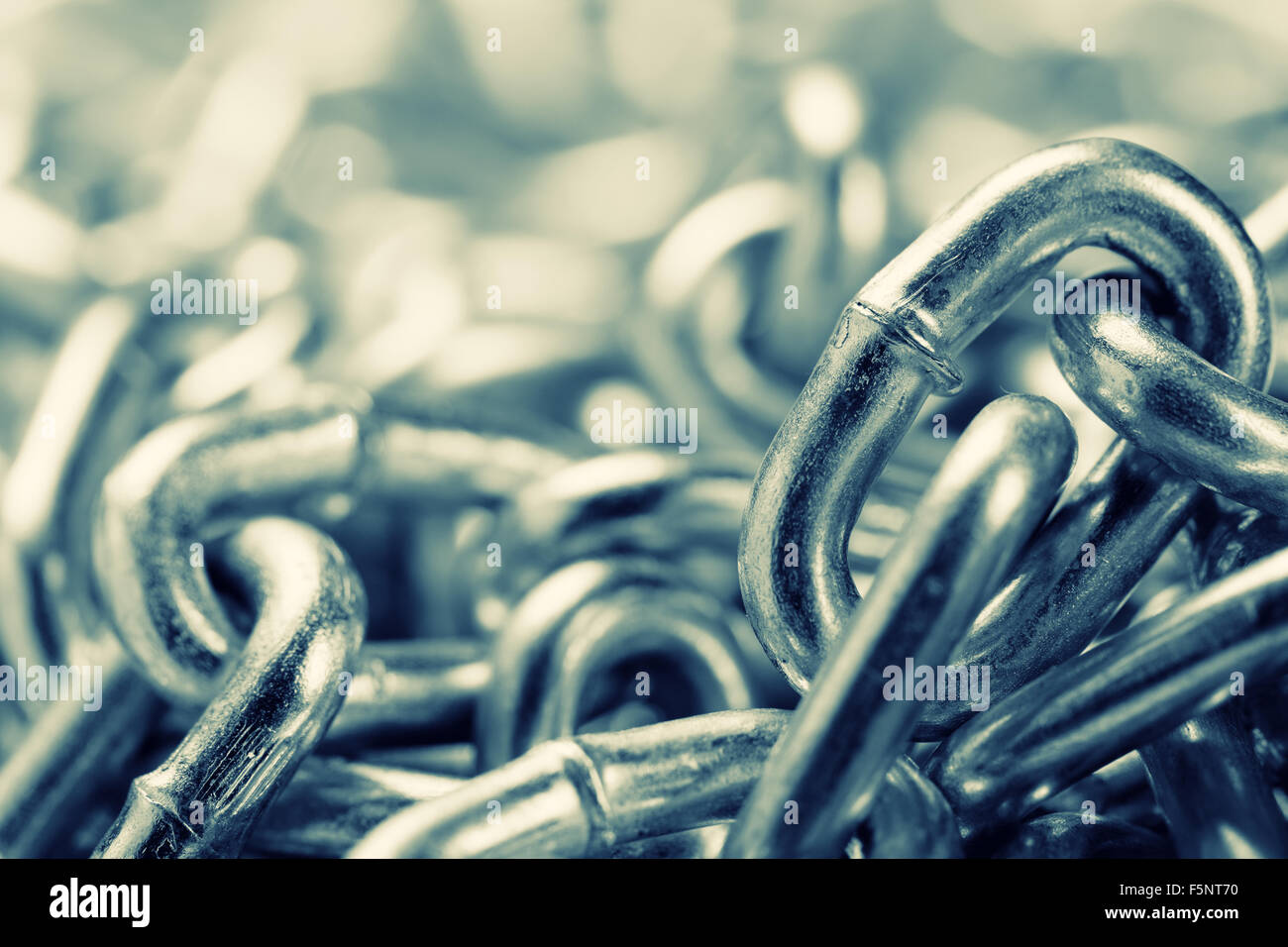 Closeup of industrial chains. Toned Stock Photo - Alamy