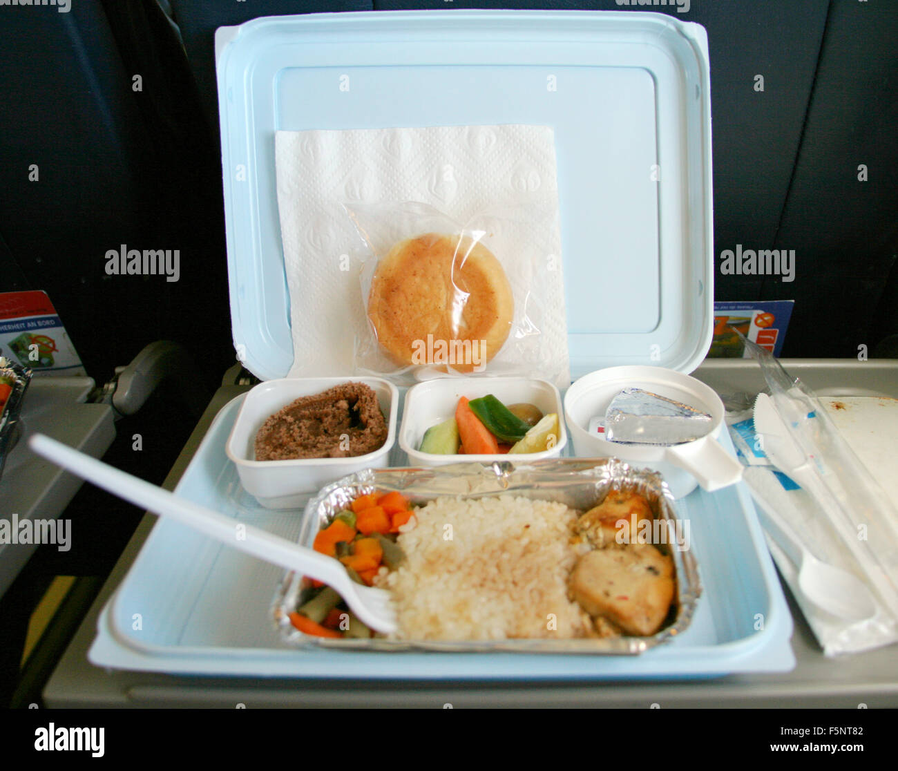 Rise and chicken. Classic airplane food Stock Photo - Alamy