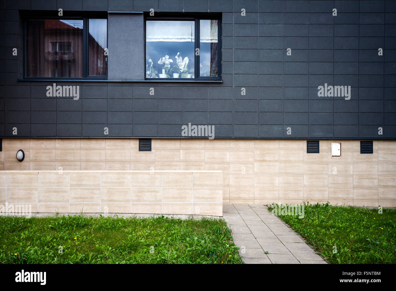 Modern tile wall with some windows Stock Photo - Alamy