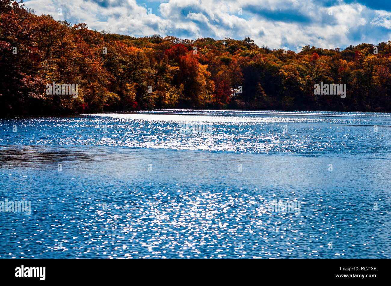 scene of blue water and sky in a fall setting Stock Photo - Alamy