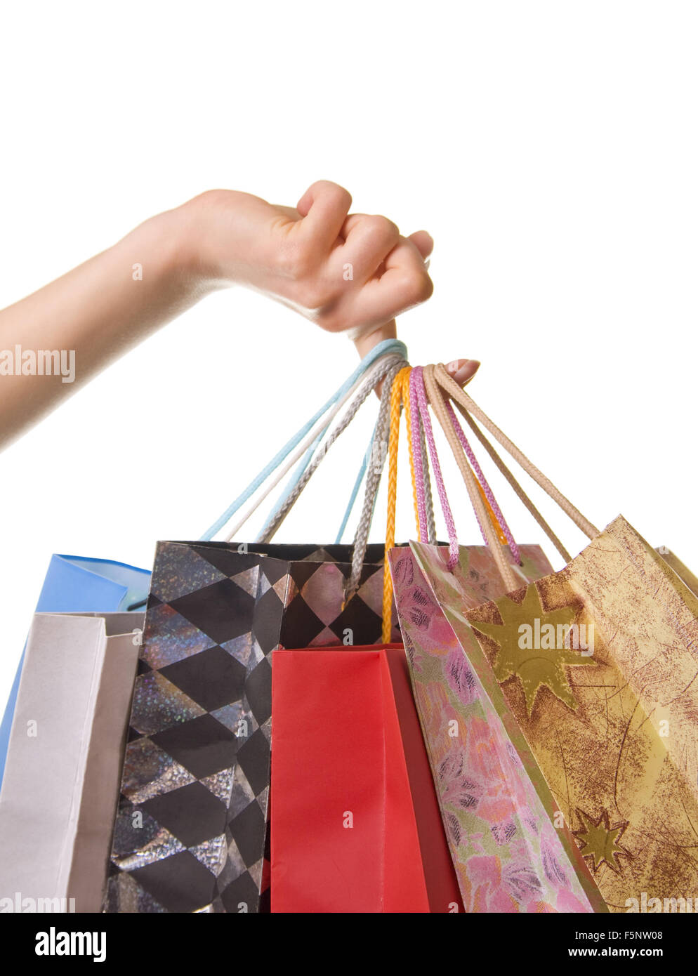 Hand holding shopping bags Stock Photo - Alamy