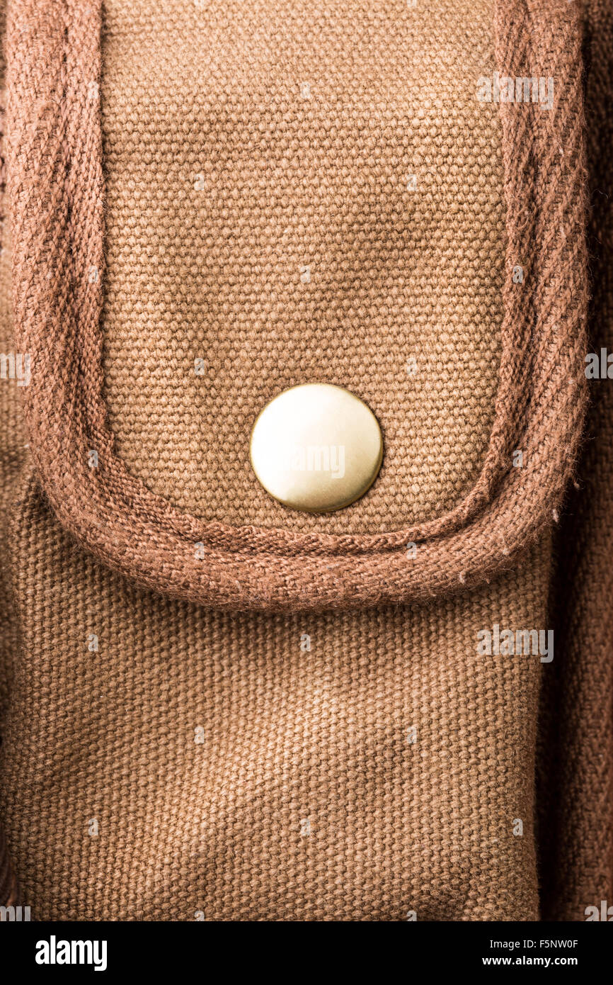 White button on brown pocket Stock Photo - Alamy