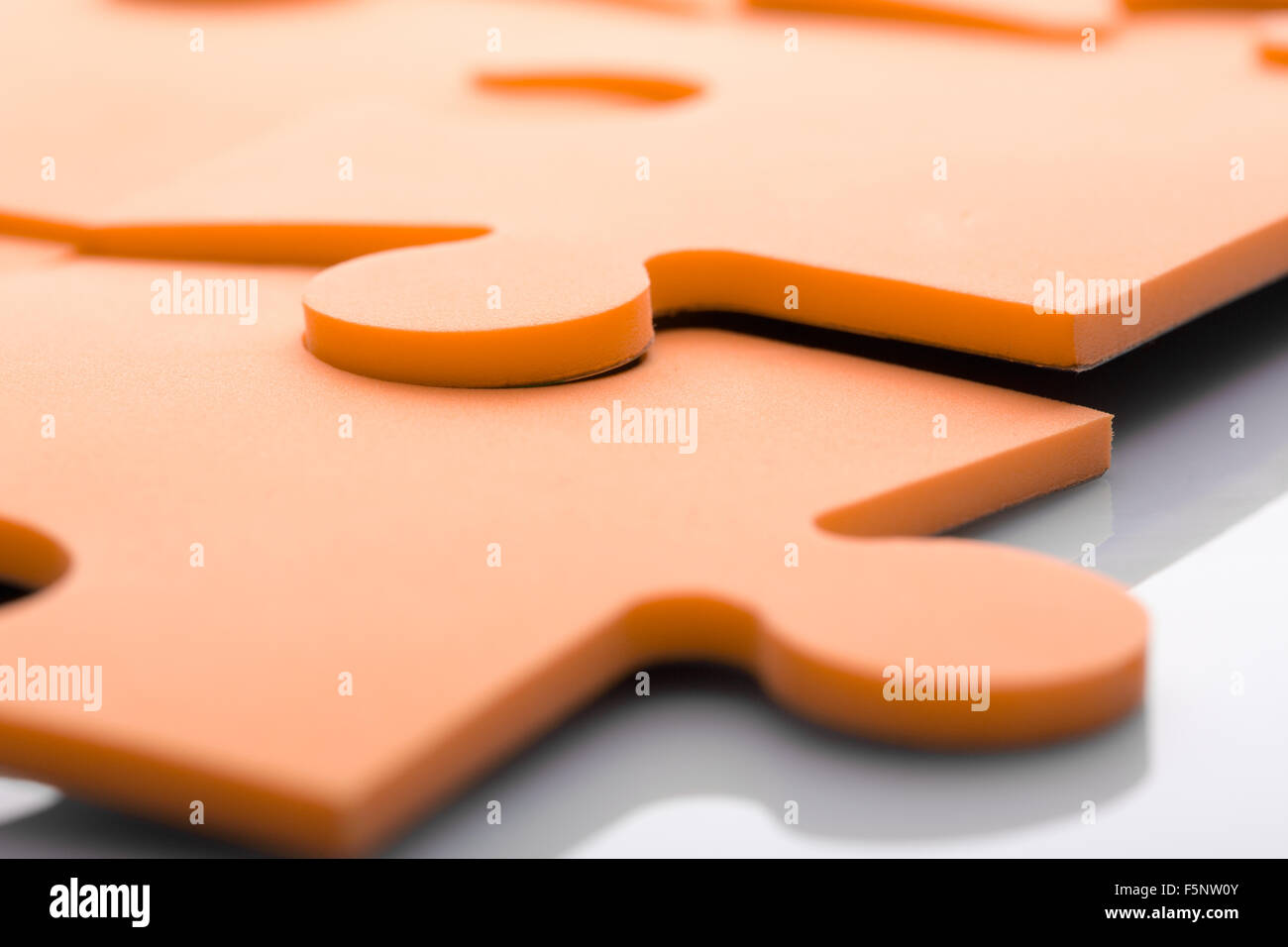 Closeup of jigsaw puzzle pieces Stock Photo - Alamy