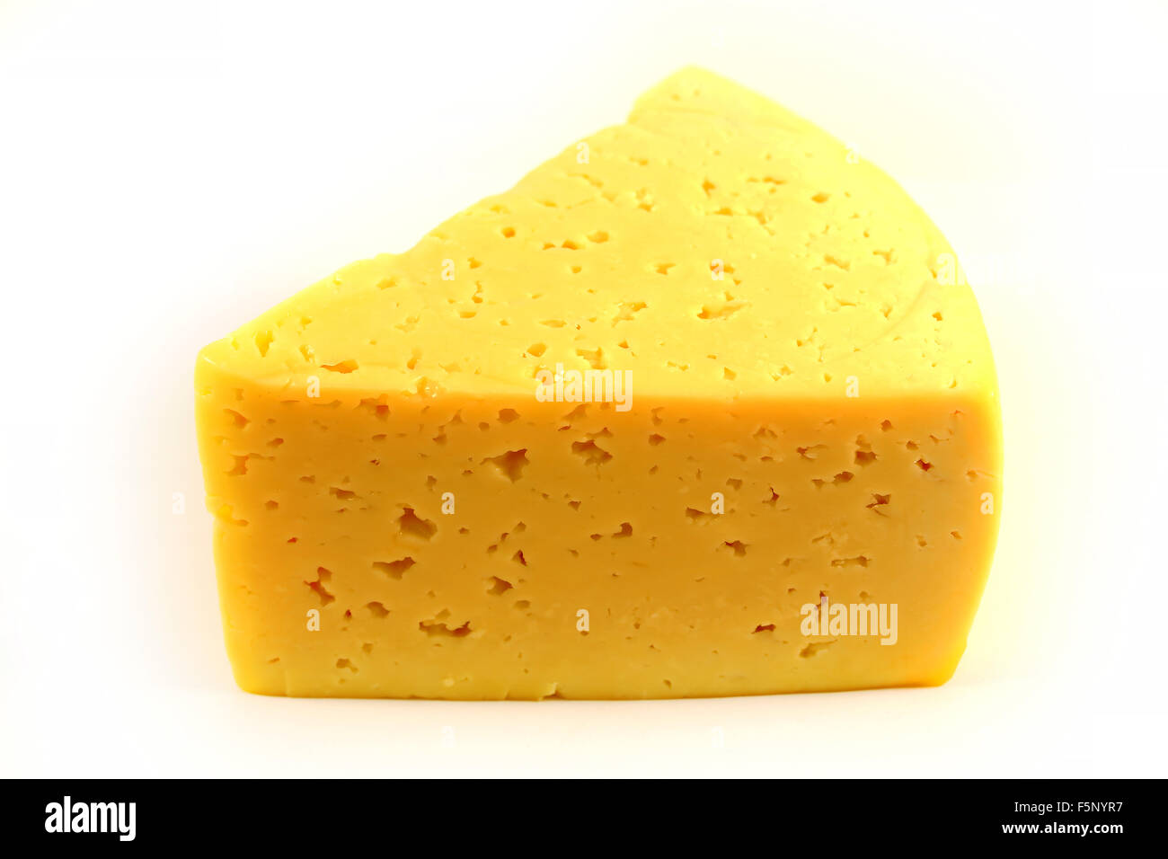 Yellow cheese photographed close up on a white background Stock Photo ...