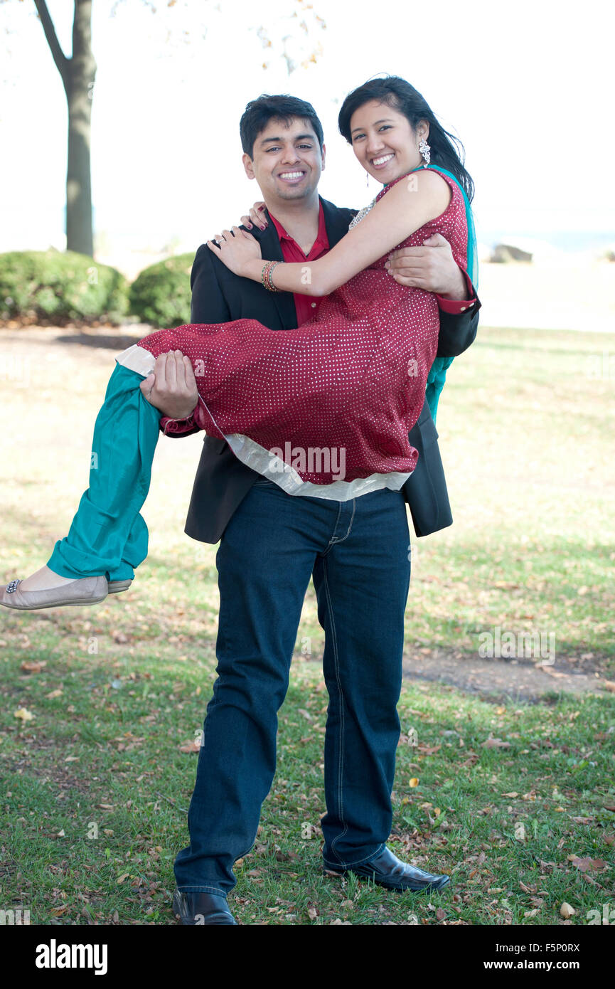 Young Happy Indian Man Carrying His Fiance Stock Photo - Alamy
