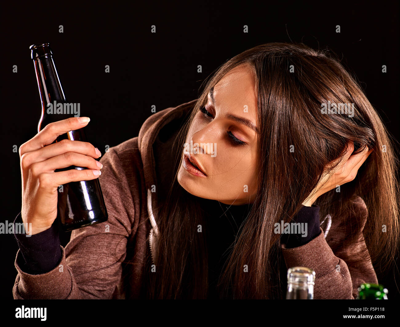 Drunk girl holding bottle of vodka Stock Photo - Alamy