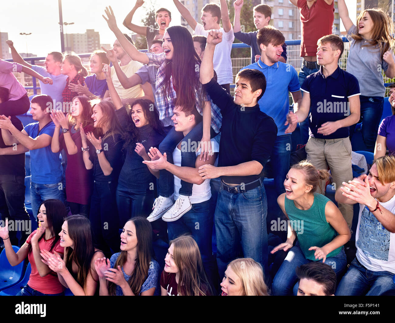 Sport fans clapping and singing on tribunes Stock Photo - Alamy