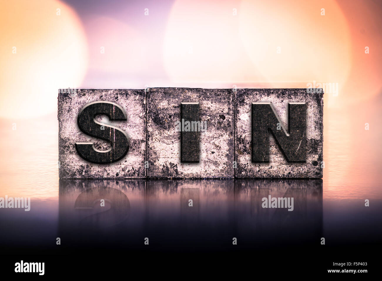 The word "SIN" written in vintage ink stained letterpress type Stock ...