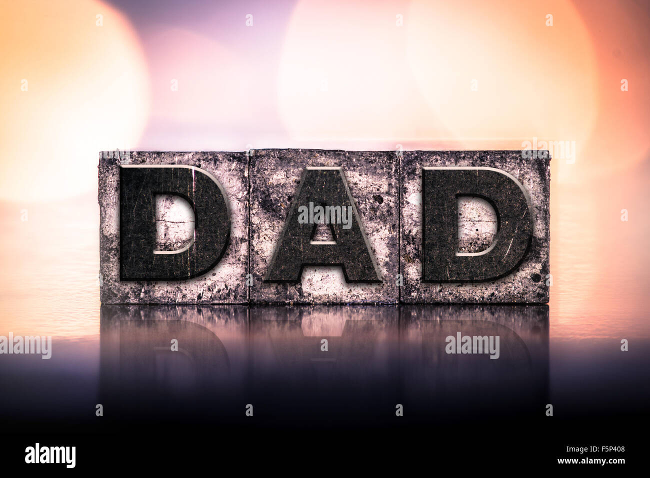 The word "DAD" written in vintage ink stained letterpress type Stock ...